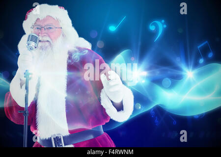 Composite image of santa claus is singing christmas songs Stock Photo ...