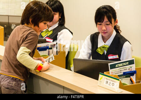 Japan, Nishinomiya, KidZania. Bank, interior, child, 9-10 years old ...