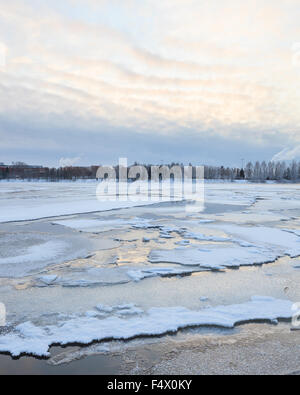 ice block covered river in winter with sandstone cliffs Stock Photo - Alamy