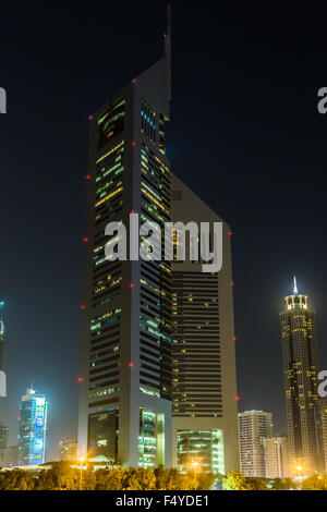 DUBAI - APRIL 18: Emirates Towers and Burj Khalifa at night time, 18 ...