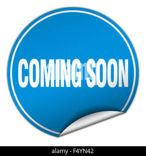 coming soon round blue sticker on white background Stock Photo - Alamy