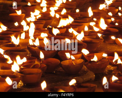 Traditional earthen lamps lit with oil, on the ocassion of Diwali ...