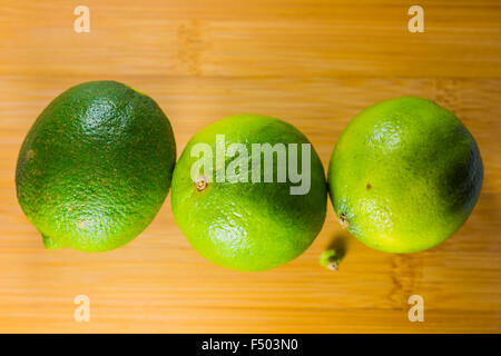Close up tropic fruits lime on the wood table Stock Photo - Alamy