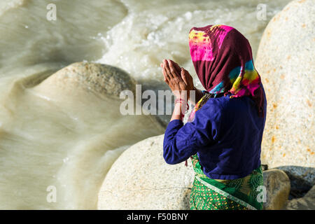 Woman praying at the Ganges river. Gangotri. Uttarakhand. India Stock ...