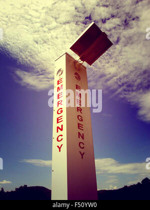 Solar powered emergency call box beside freeway for motorist in ...