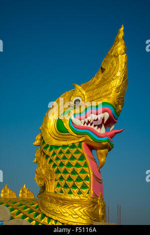 Large golden naga on the blue sky background Stock Photo - Alamy