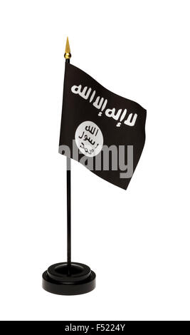 Small flag of ISIL, ISIS in a stand with grey background. High angle ...
