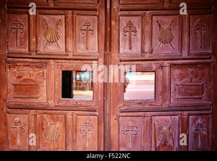End of Saint James Way sign and lighthouse of Finisterre in Galicia ...