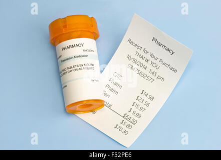 Pharmacy receipt with prescription bottle on natural wood desktop Stock ...