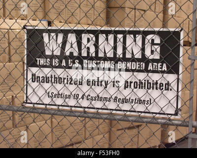 warning bonded area sign in warehouse Stock Photo - Alamy