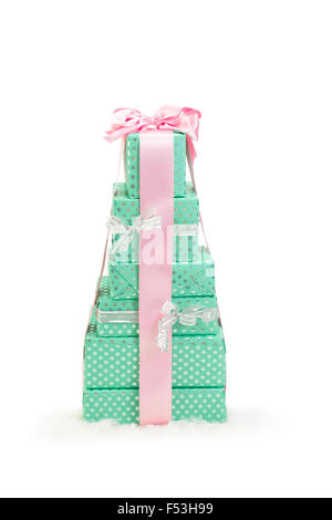 Stack of silver wrapped presents with a pink bow Stock Photo - Alamy