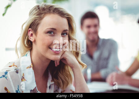 Creative business team working hard together on pc Stock Photo - Alamy