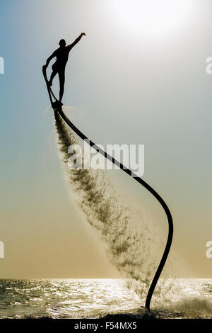 Silhouette of a fly board rider Stock Photo - Alamy