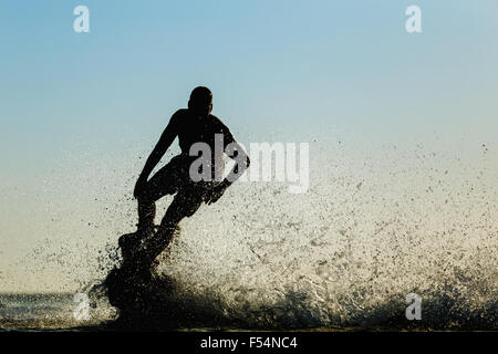 Silhouette of a fly board rider Stock Photo - Alamy