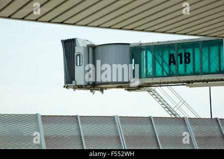 Passenger boarding bridge with stairs at airport gate. Ground ...
