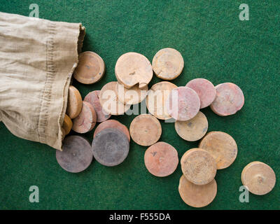 Old game pieces on display in the games room. A bag of numbered wooden ...