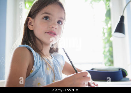 cute girl doing homework Stock Photo - Alamy