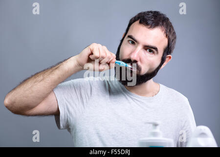 Man with Beard Washing His Teeth with a Toothbrush Stock Photo - Alamy