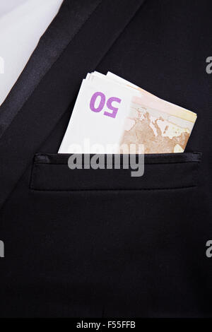 many euro banknotes in businessman hand isolated on white background ...