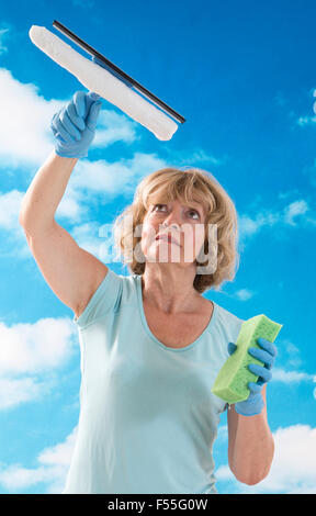 cleaning window with squeegee blue sky Stock Photo - Alamy