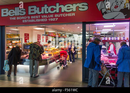 People shopping in Bell's Butchers, established 1927 and located in ...