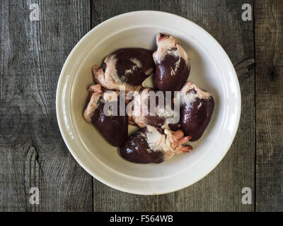 Oct. 26, 2015 - Raw Turkey hearts in bowl on old wooden table (Credit ...