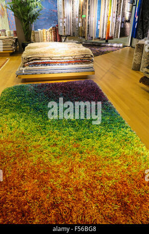 Many colorful carpets in the store. Background. Carpet Rolls Shop ...