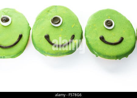 Alien cookies with green icing prepared as Halloween treats Stock Photo ...