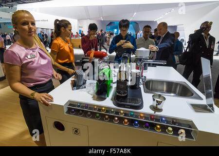 BERLIN - SEPTEMBER 04, 2015: Visitors taste the coffee from the ...