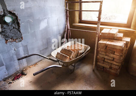 Unfinished brick apartment building with wooden roof structure under ...