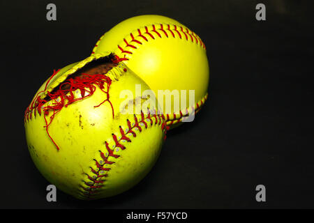 softball ball isolated on dark background Stock Photo - Alamy