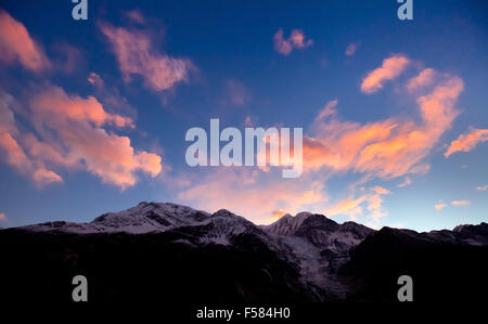Panoramic sunset sky with vibrant pink and orange clouds against a deep ...