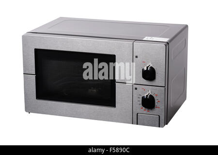 metallic covered microwave with manual dial, isolated on white Stock ...