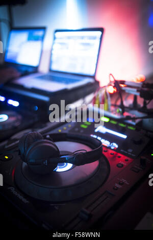 DJ console cd mp4 deejay mixing desk buttons and knobs in Ibiza house ...