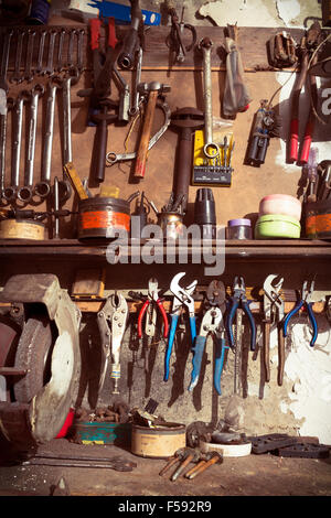 Obsolete hand tools. Old hand drill. Cracked wooden background. Dirty ...