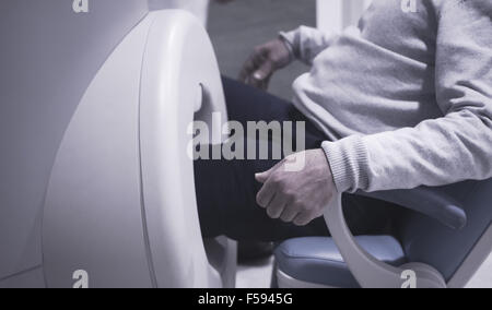 Patient in fully open MRI CAT Scan scanning arm, elbow, forearm, hand ...