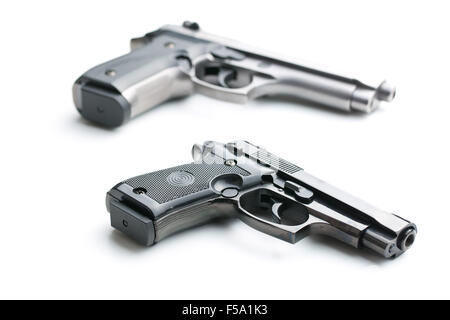two handguns on white background Stock Photo - Alamy