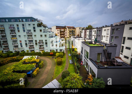 Modern apartment buildings in Berlin with a reflection in a small canal ...