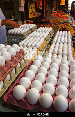 Fresh eggs in carton at a market in the morning Stock Photo - Alamy
