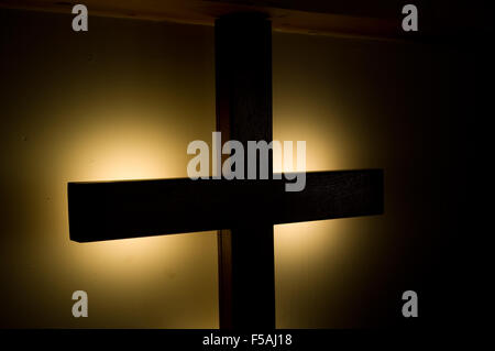 cross with light shining from behind. Ideal for churches Stock Photo ...
