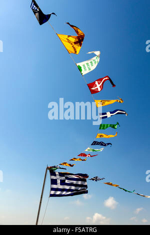 Religious flags wave on the local shop of worship and religious things ...