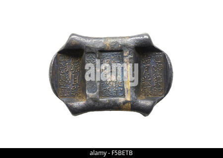 An ancient Chinese silver ingot or sycee of Ming Dynasty is on display ...