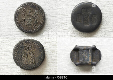 An ancient Chinese silver ingot or sycee of Ming Dynasty is on display ...
