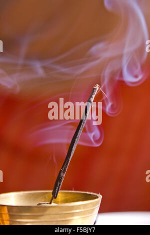Fuming incense stick Stock Photo - Alamy