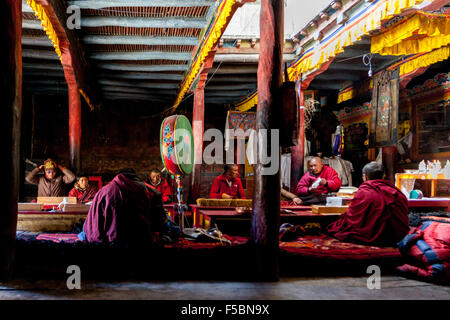 Buddhist monks reading religious scrolls at the courtyard of the Hanle ...