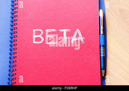 Beta text concept write on notebook Stock Photo - Alamy