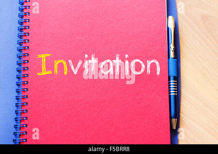 Invitation write on notebook Stock Photo - Alamy
