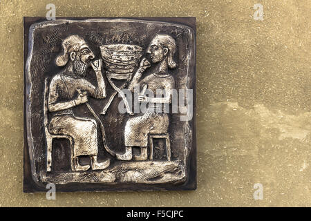 An ancient Mayan relief on bronze tablet with golden tones Stock Photo ...
