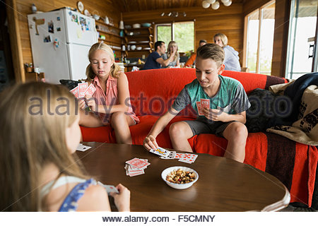 Brother and sister playing cards Stock Photo: 15954190 - Alamy