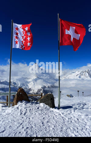 Flag of the Canton du Valais, and the Swiss national flag, Swiss Alps ...
